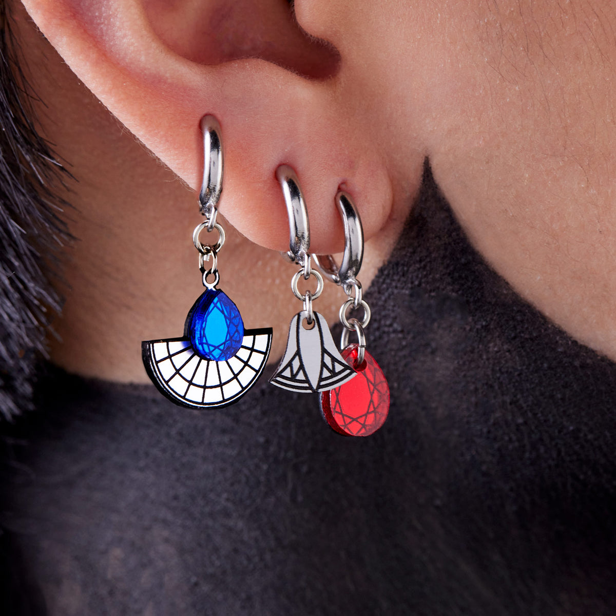 CLEOPATRA CHARMED HUGGIE HOOPS | Cobalt Blue and Silver Sunburst ...